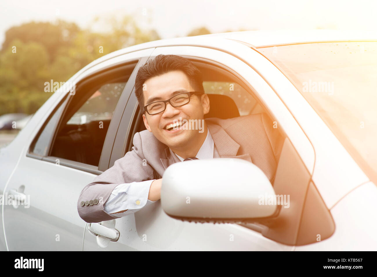 Happy driver smiling Stock Photo - Alamy