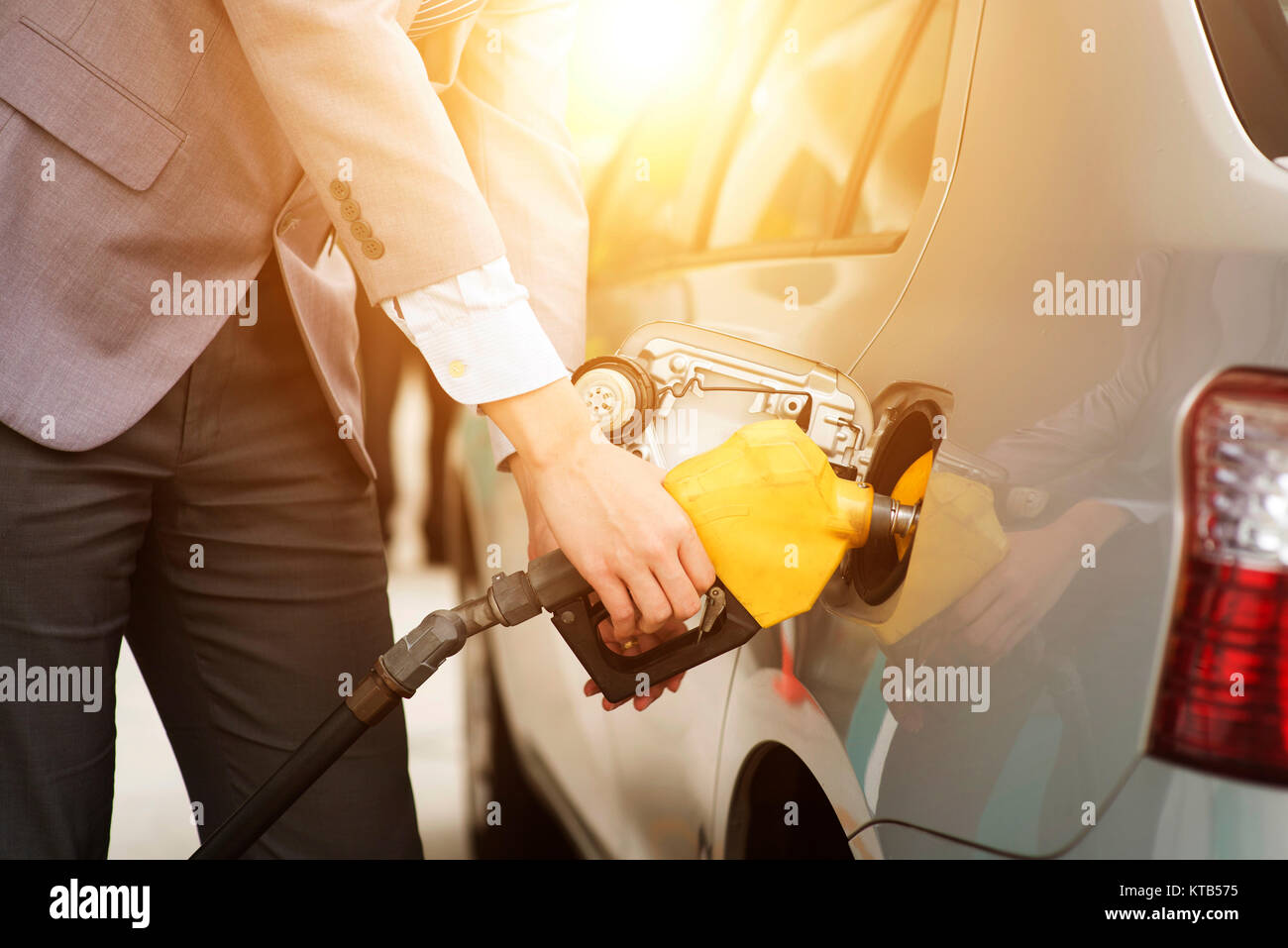 Man pumping petrol Stock Photo - Alamy