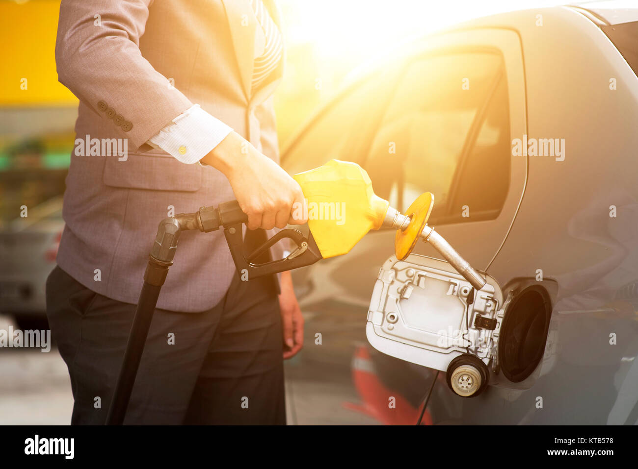 Man pumping fuel Stock Photo - Alamy