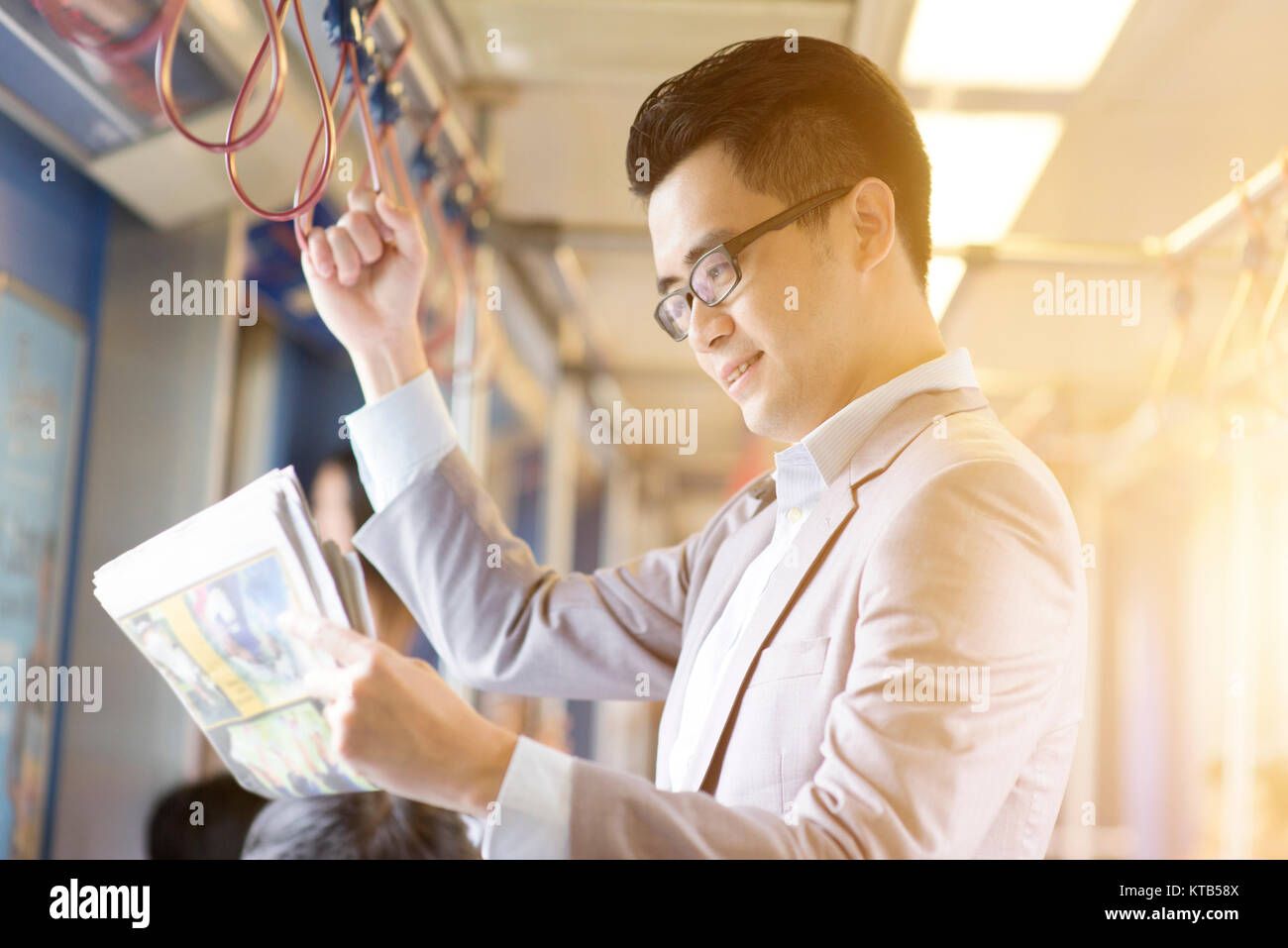 Taking public transport to work Stock Photo - Alamy