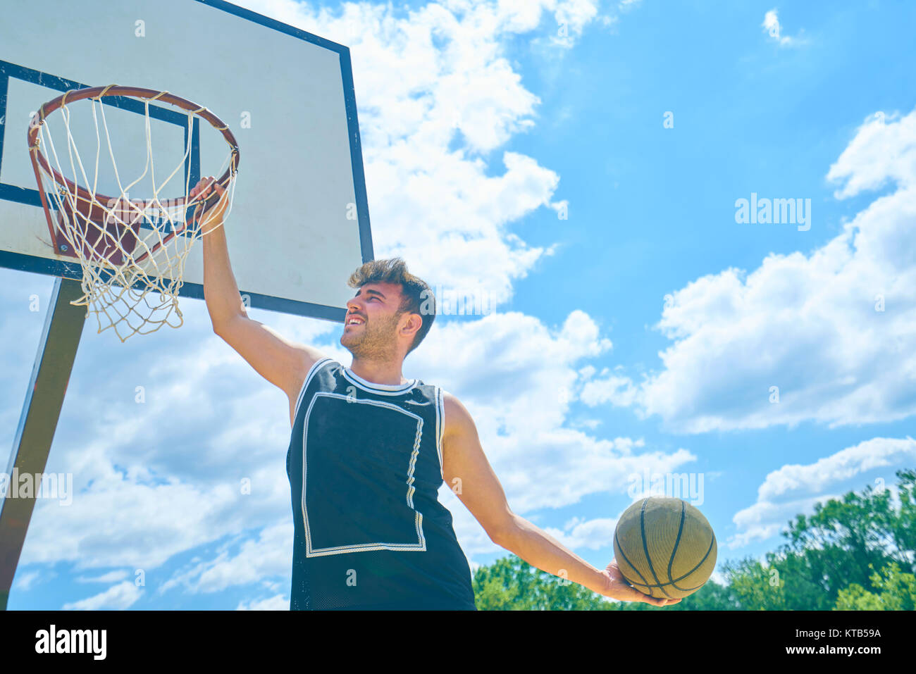 Young person playing basketball Stock Photo - Alamy