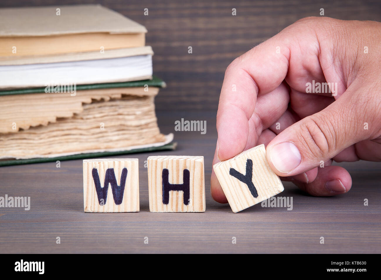 why. Wooden letters on dark background. Office desk Stock Photo - Alamy