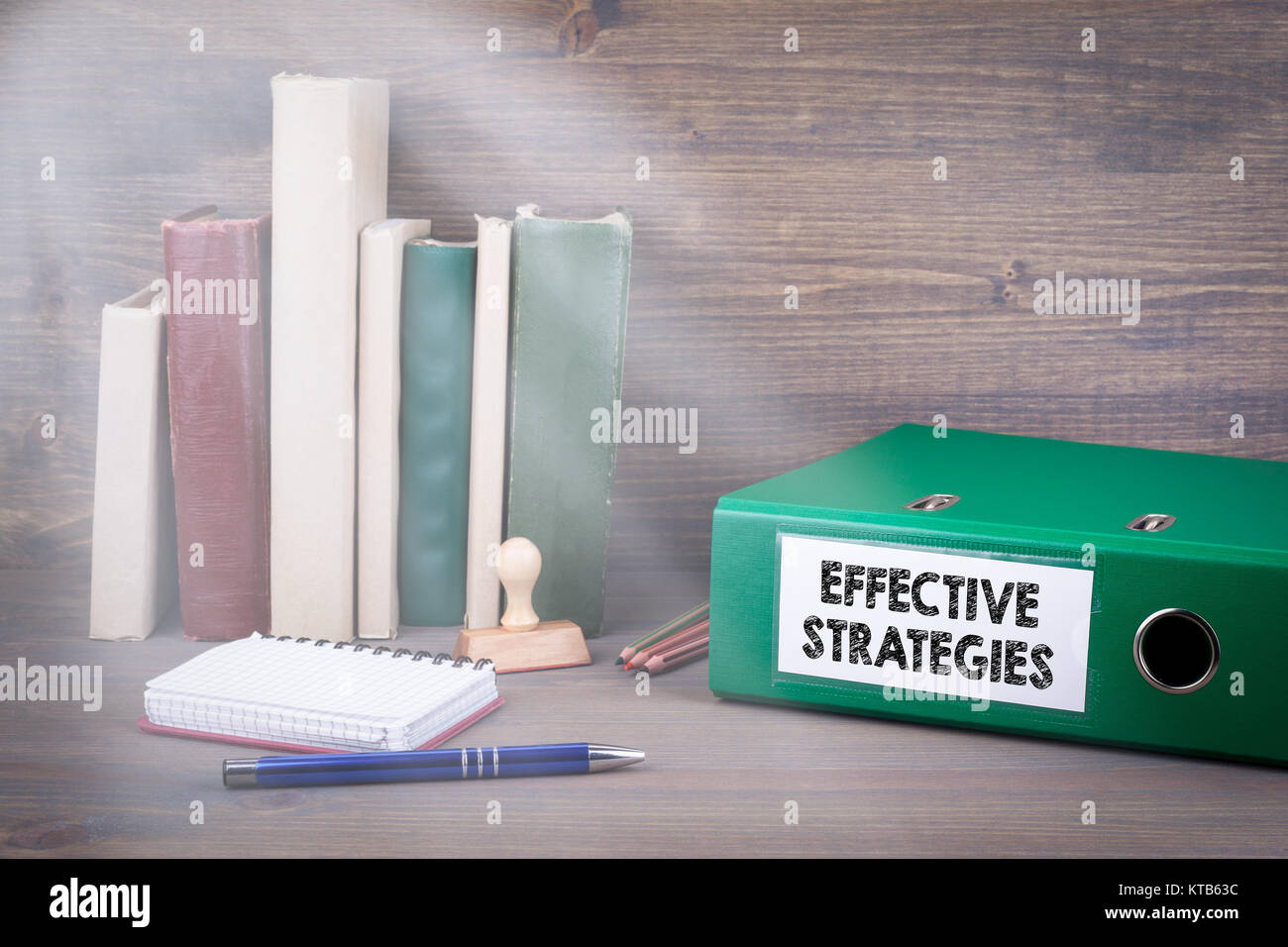 Effective Strategies. Binder on desk in the office. Business background ...