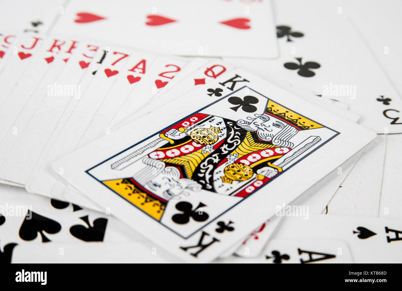 Playing cards spreaded on the white background Stock Photo - Alamy