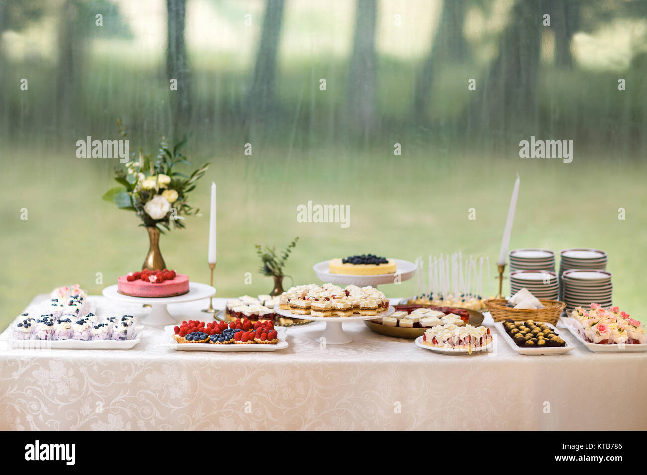 Table with loads of cakes, cupcakes, cookies and cakepops Stock Photo ...