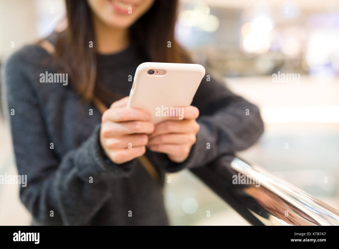 Woman working on mobile phone Stock Photo - Alamy