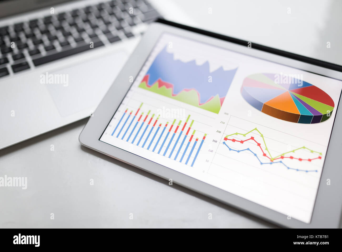 Digital tablet showing information chart Stock Photo - Alamy