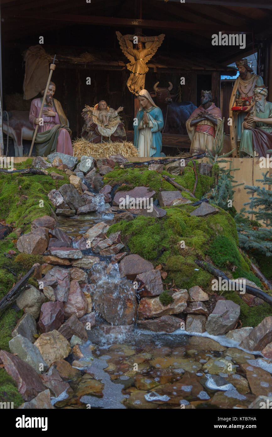 The nativity scene is set in a larger landscape with a waterfall. The ...