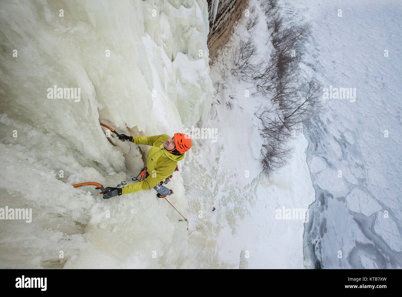 An ice climber in Northern Michigan, climbing at Pictured Rocks ...