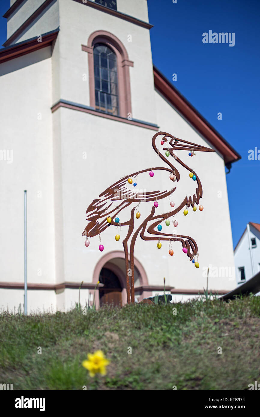 stylized stork with easter eggs,in the background a church Stock Photo ...