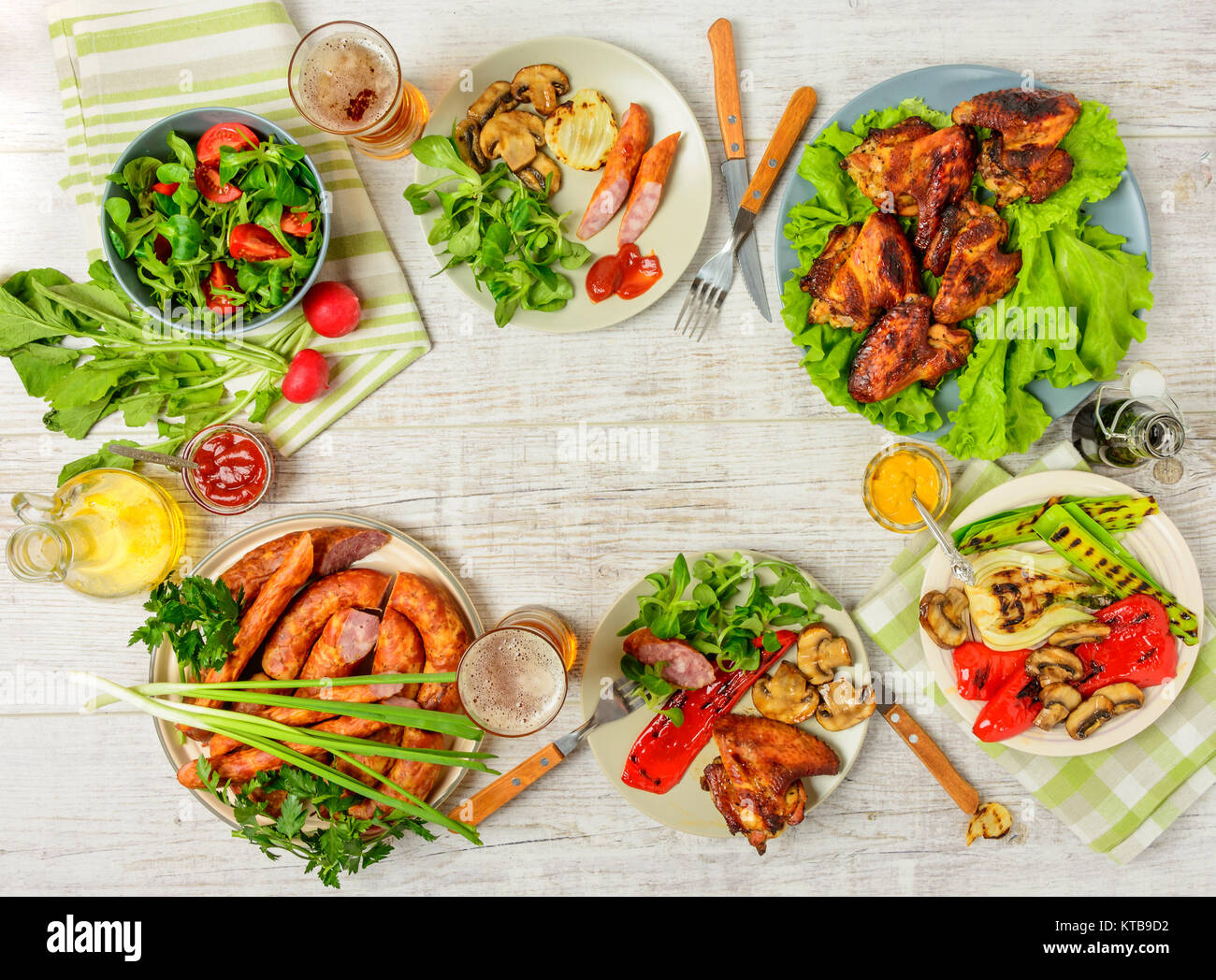 Dinner table with variety food Stock Photo - Alamy