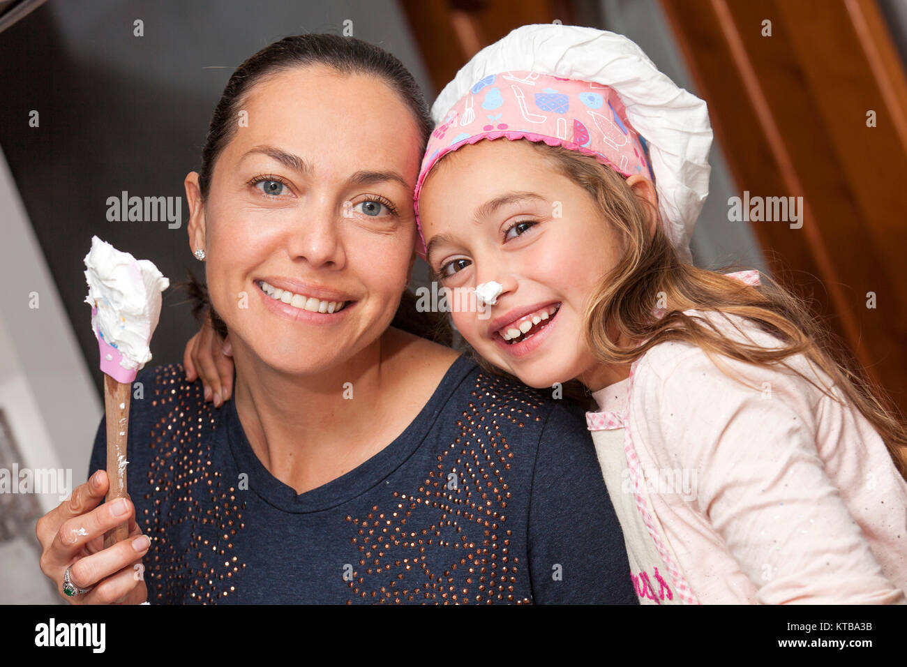 Having fun with mom while cooking Stock Photo - Alamy