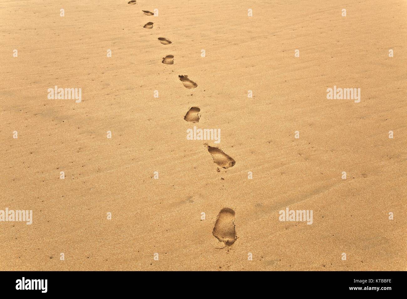 Footsteps in Sand Stock Photo - Alamy