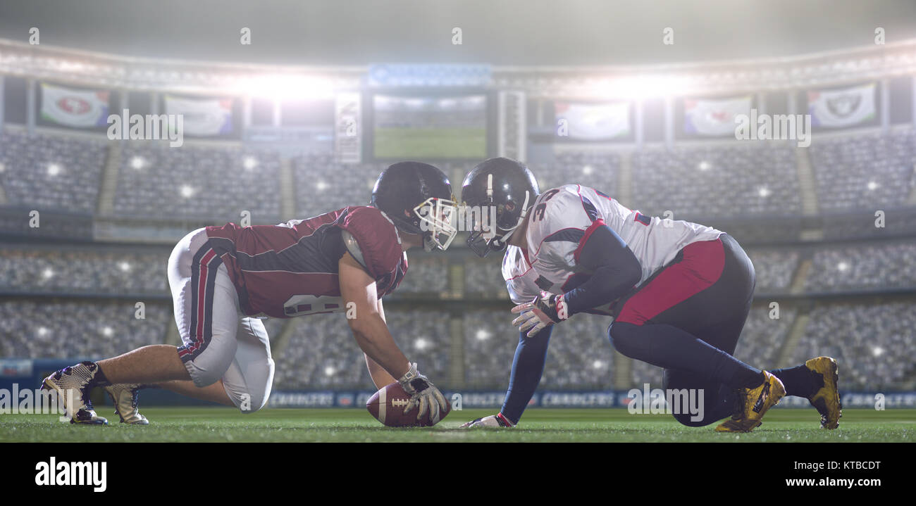 american football players are ready to start a match on modern field at ...