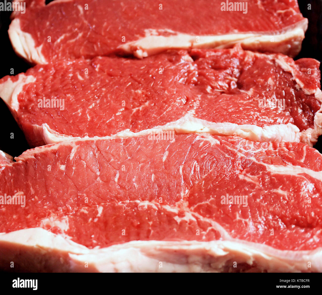 Thick Sirloin Steaks fresh from the Butcher Stock Photo - Alamy