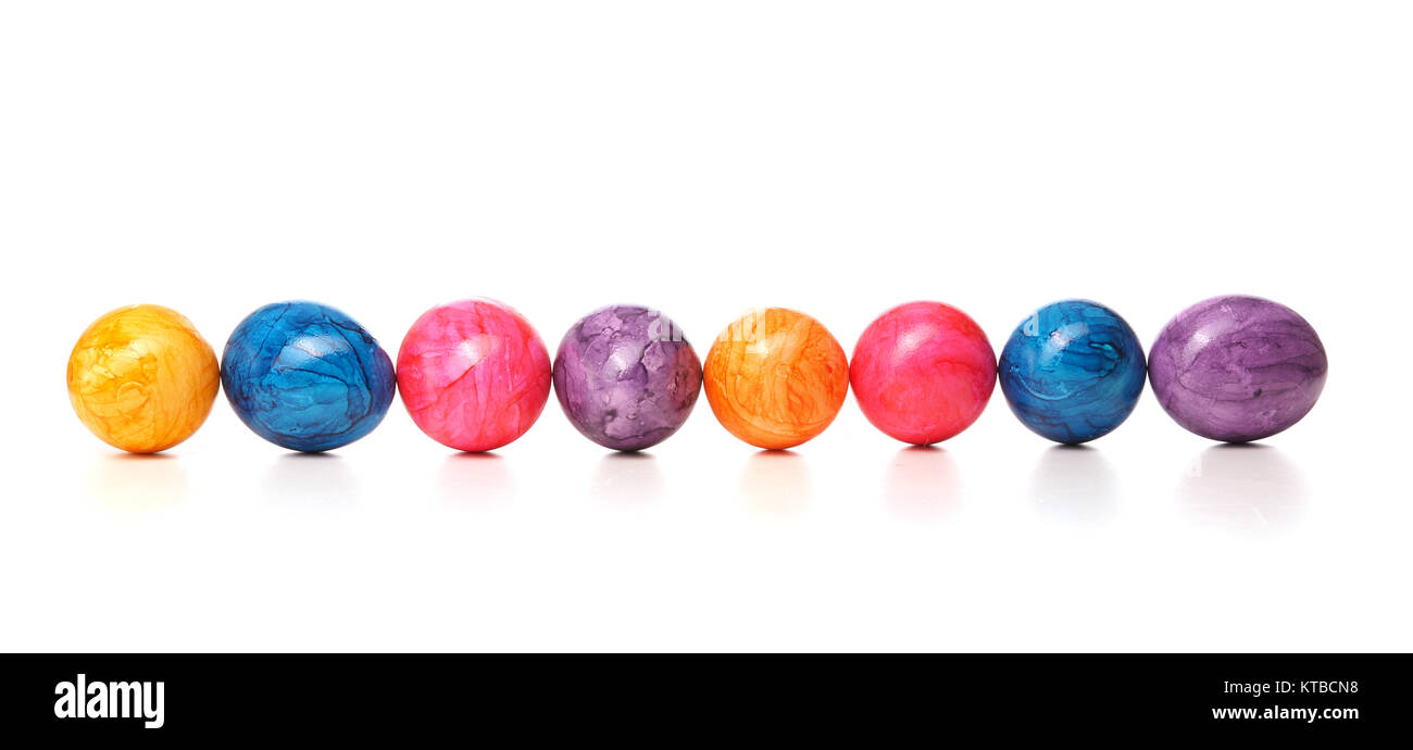 Eight colored eggs in a row on a white background, Easter header or ...