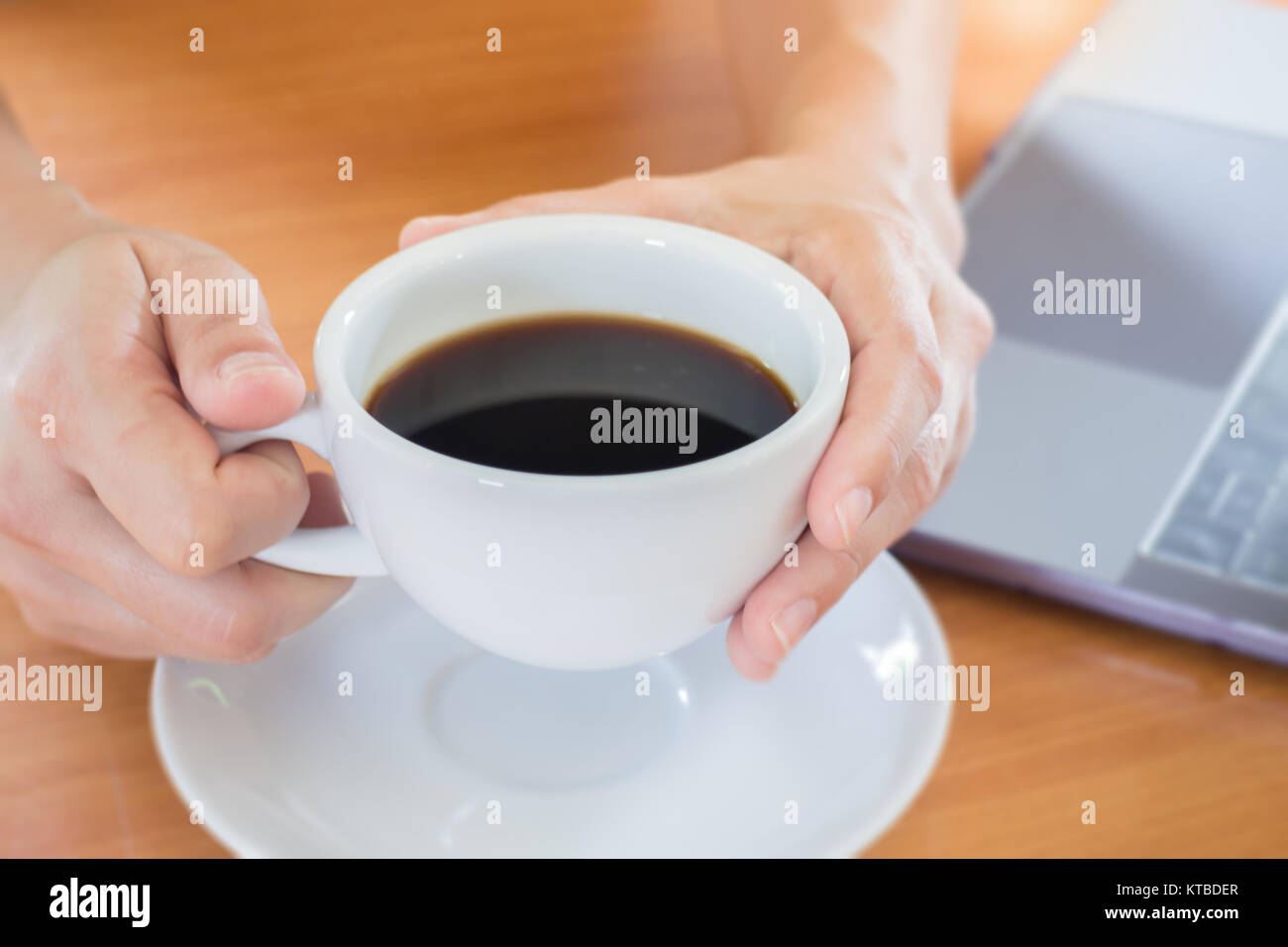 Hand On Hot Cup Of Coffee Stock Photo - Alamy
