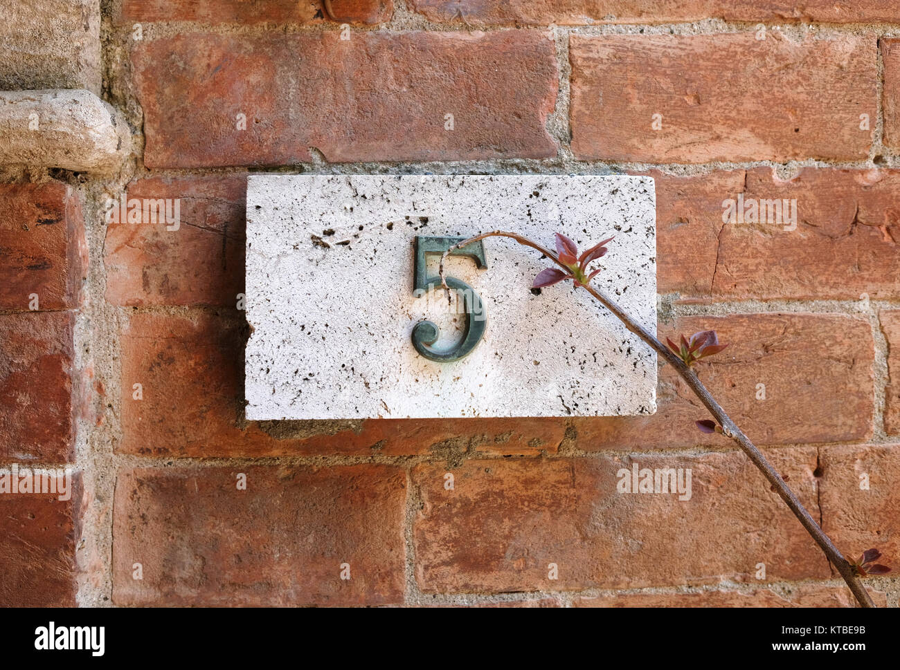House number on wall Stock Photo - Alamy