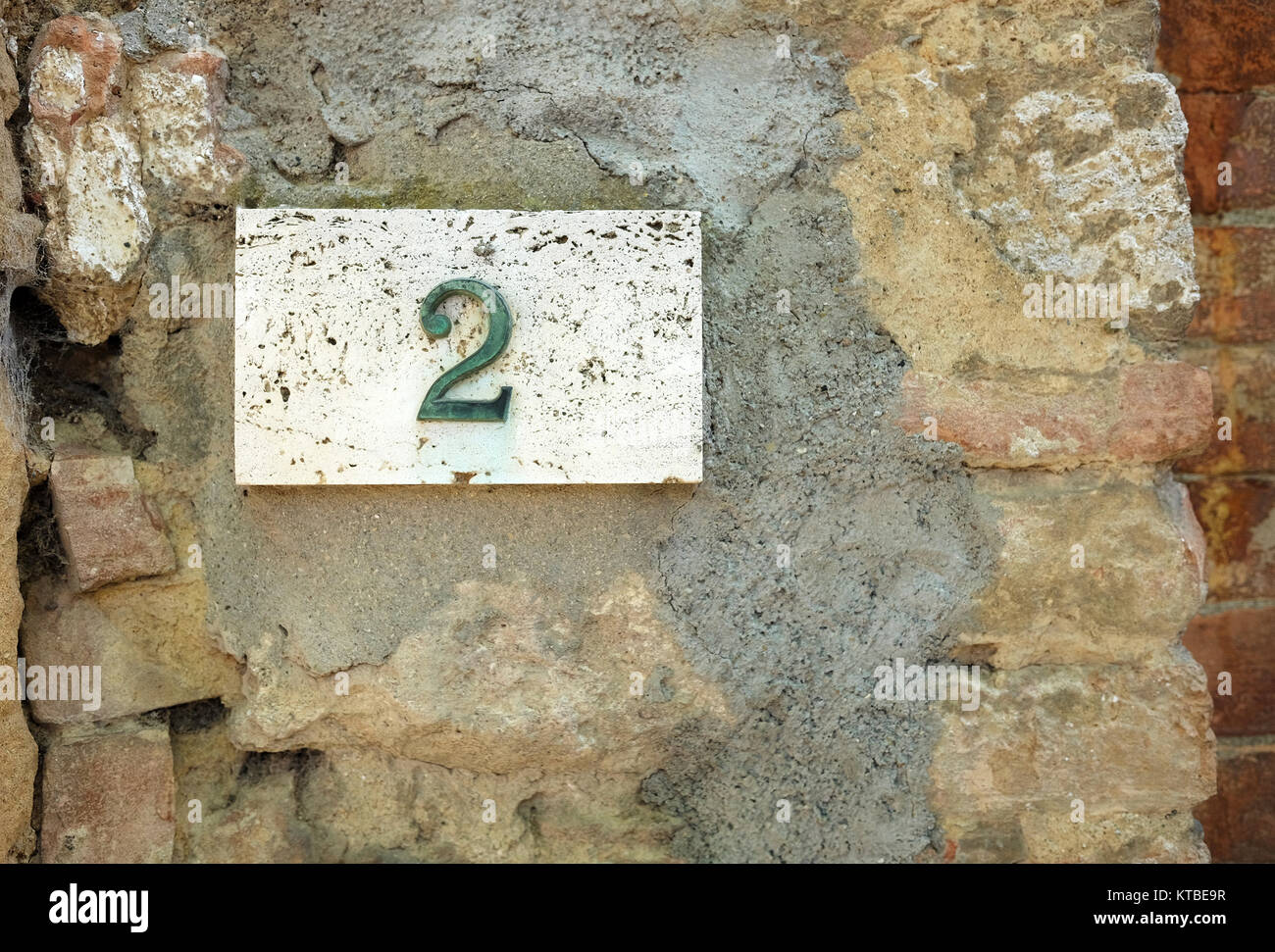 House number on wall Stock Photo - Alamy