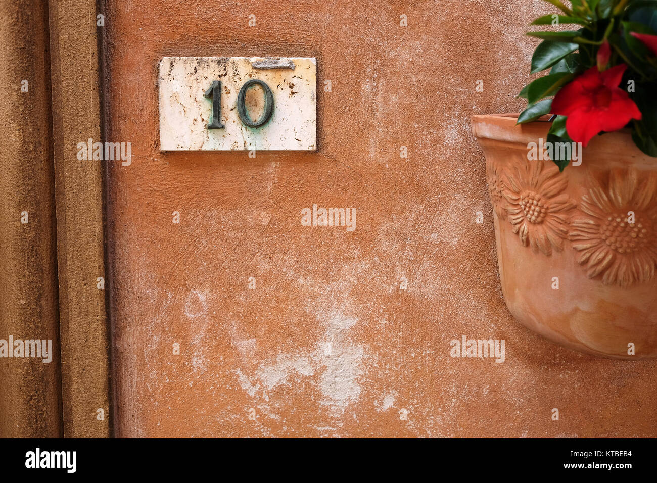 House number on wall Stock Photo - Alamy