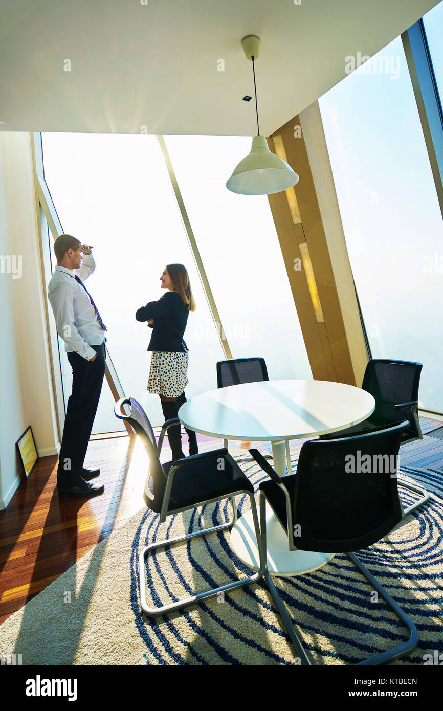 Businesspeople using laptop at conference table Stock Photo - Alamy Businesspeople using laptop at conference table Stock Photo - Alamy
