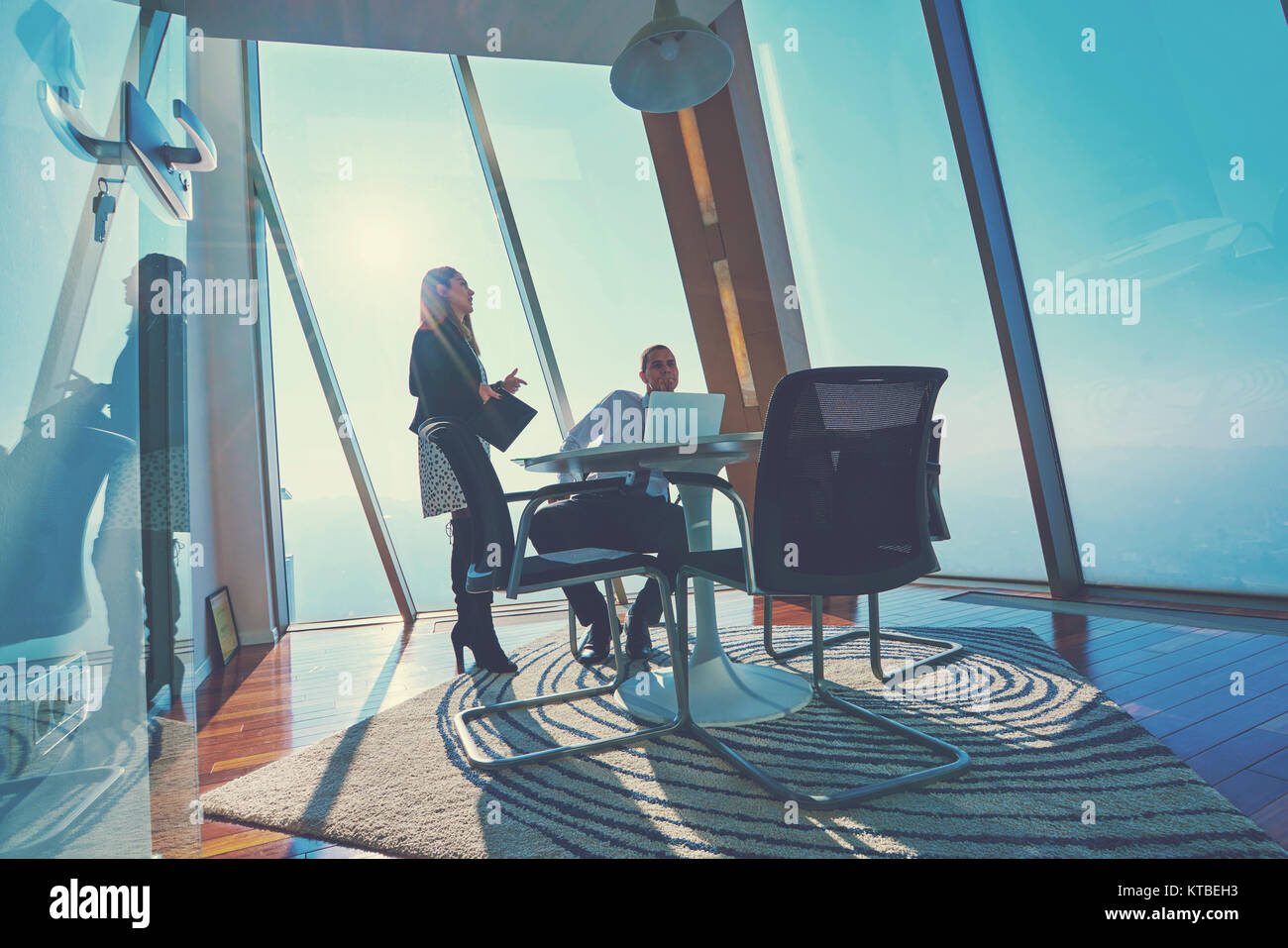 Businesspeople using laptop at conference table Stock Photo - Alamy Businesspeople using laptop at conference table Stock Photo - Alamy