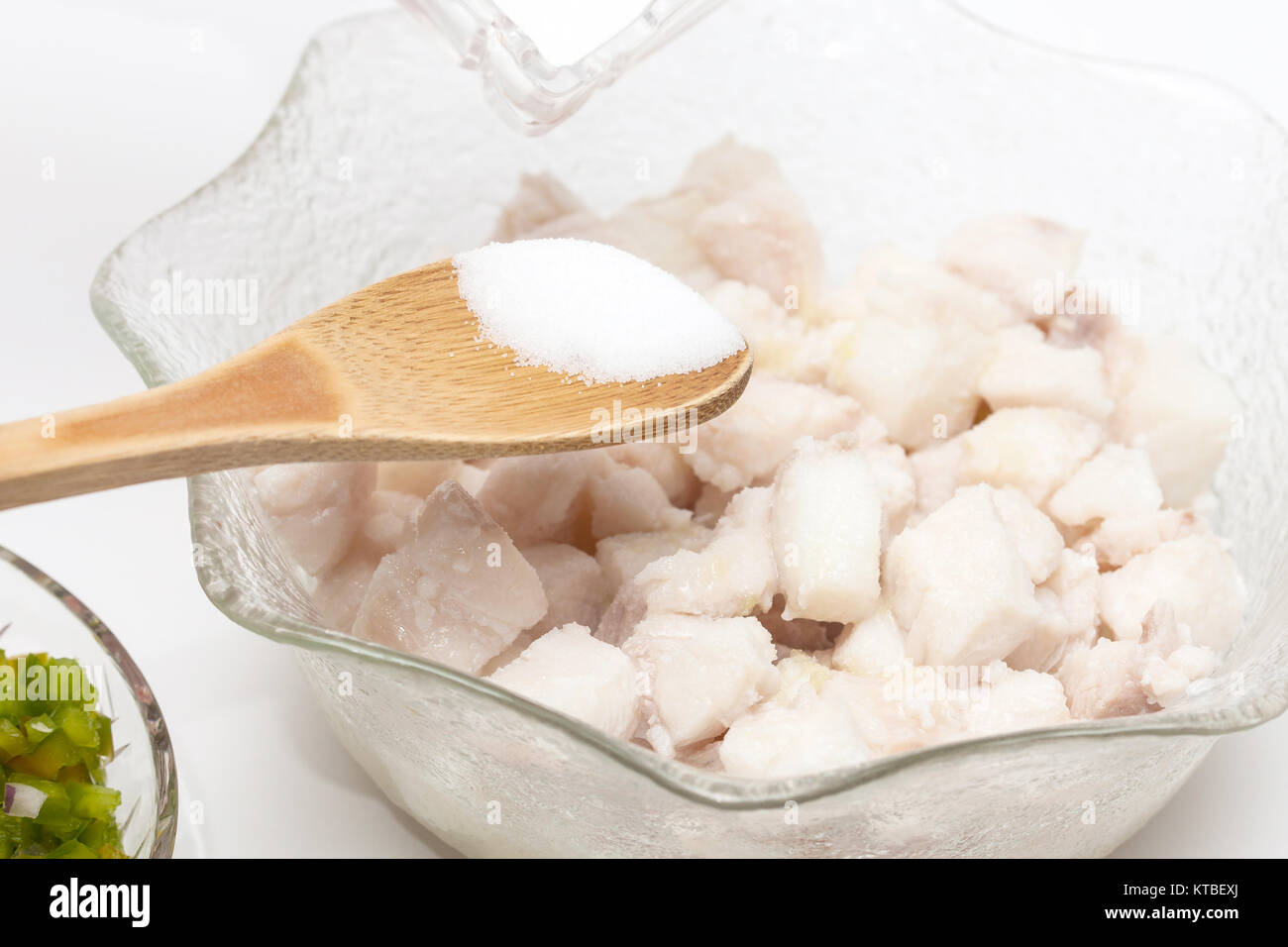 Blanched fish, lemon juice and chopped vegetables Stock Photo - Alamy