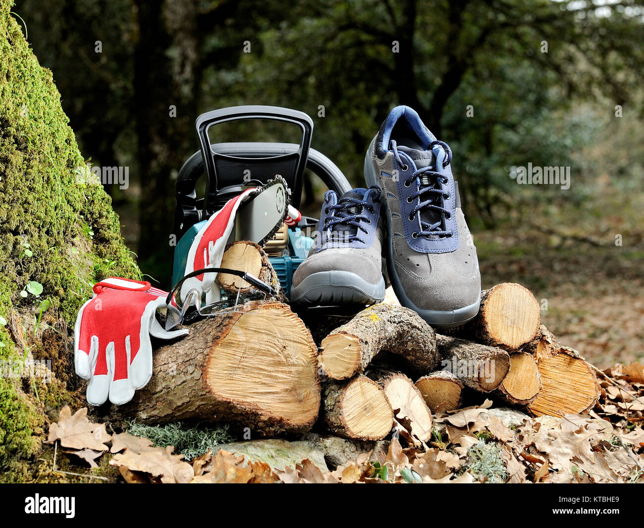 shoes,gloves and safety goggles for safe use of a chainsaw Stock Photo ...
