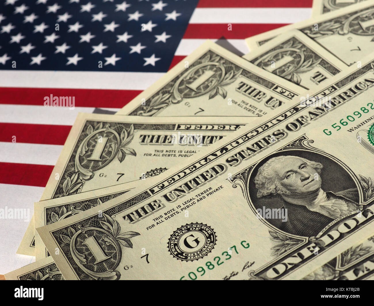 Dollar notes and flag of the United States Stock Photo - Alamy