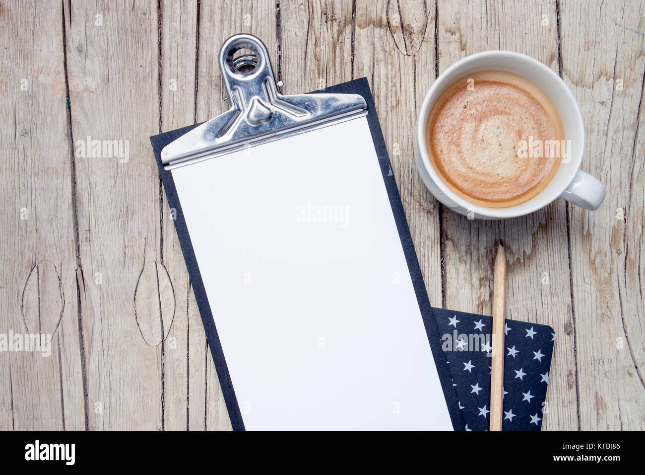 office desk with notepad and cup of coffee Stock Photo - Alamy