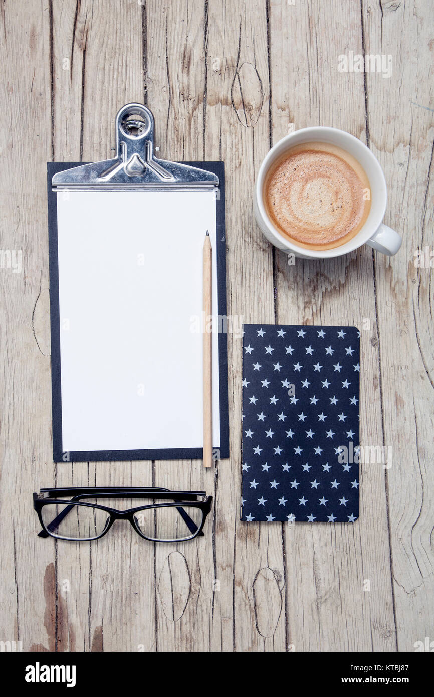 office desk with notepad and cup of coffee Stock Photo - Alamy