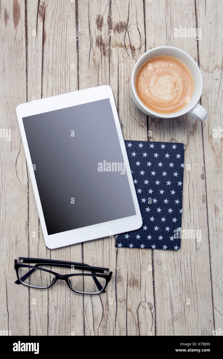office desk with mock up tablet and handy Stock Photo - Alamy