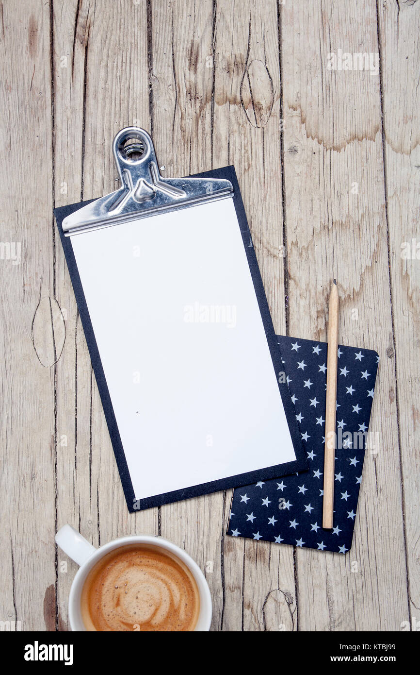 office desk with notepad and cup of coffee Stock Photo - Alamy