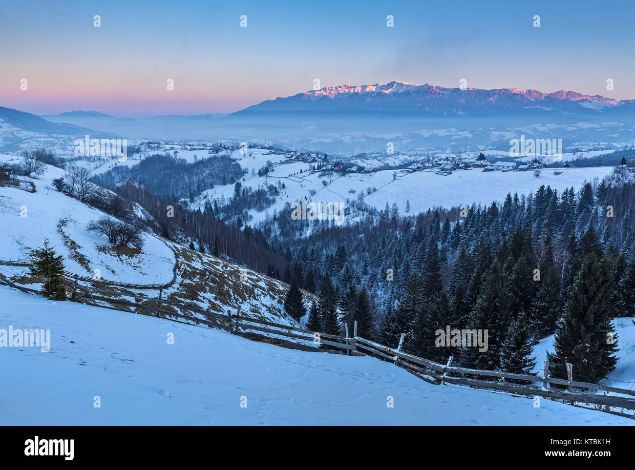 Picturesquet rural landscape with the snowy Rucar-Bran pass in the ...