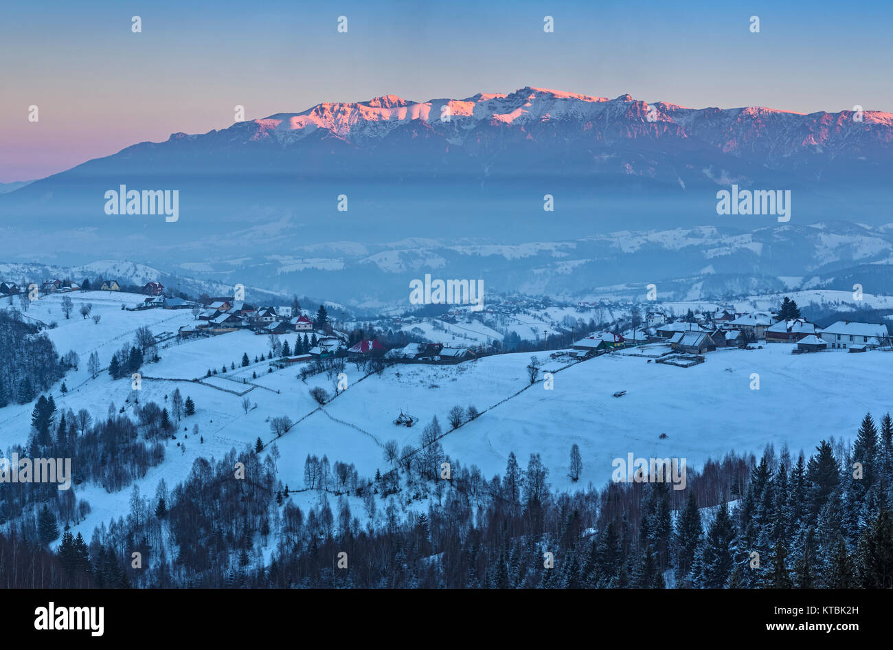 Picturesquet rural landscape with the snowy Rucar-Bran pass in the ...