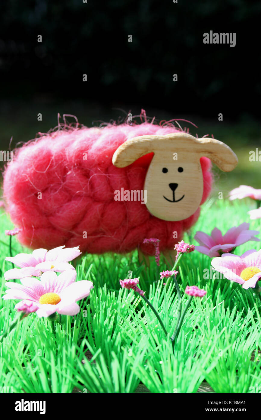 pink sheep on a flower meadow Stock Photo - Alamy