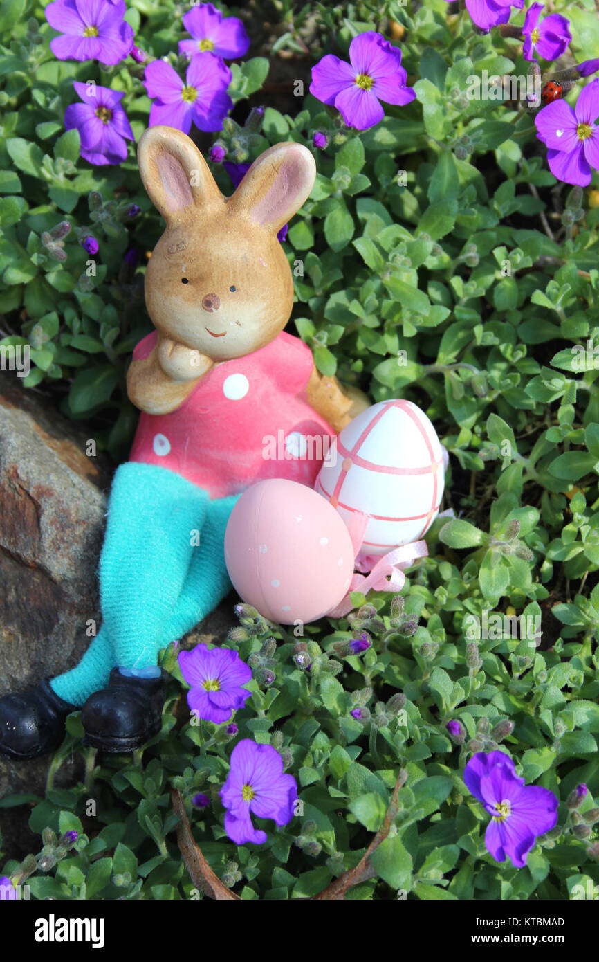 easter bunny with easter eggs in the garden Stock Photo - Alamy