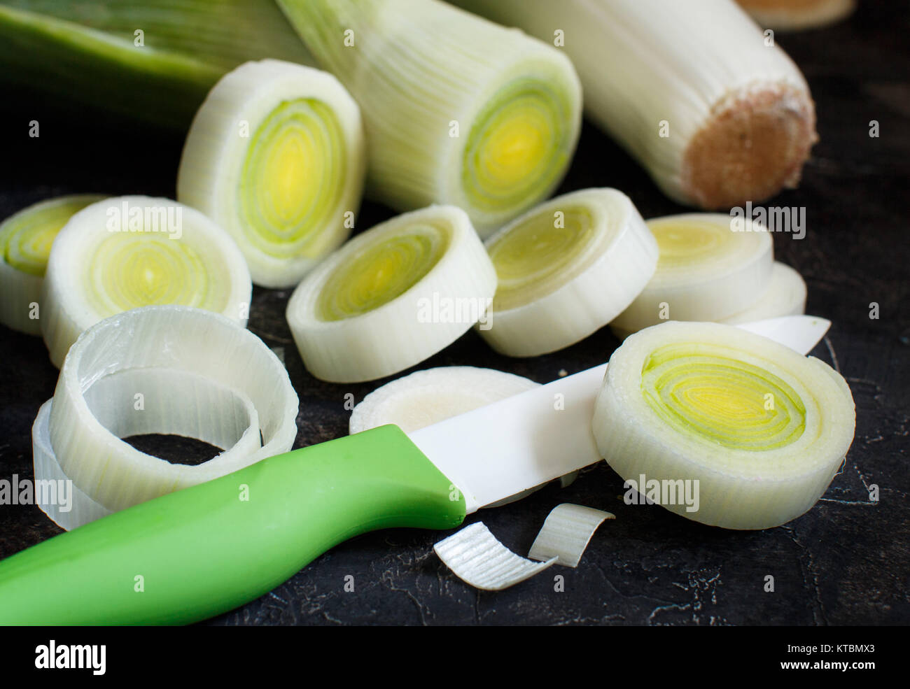 Fresh leeks whole and sliced Stock Photo - Alamy