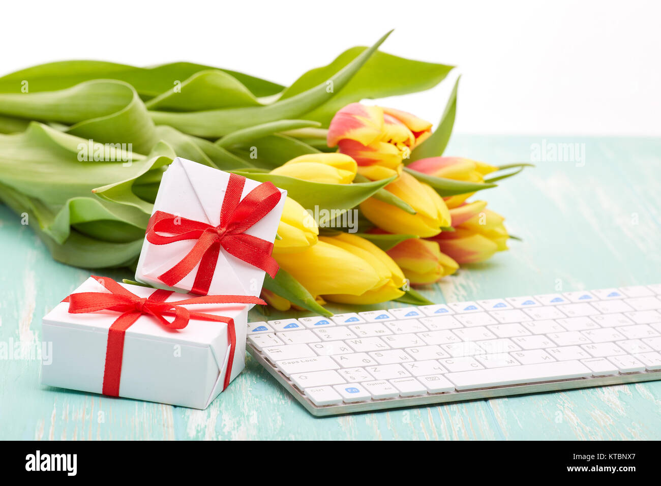 Keyboard, gifts and flowers Stock Photo - Alamy