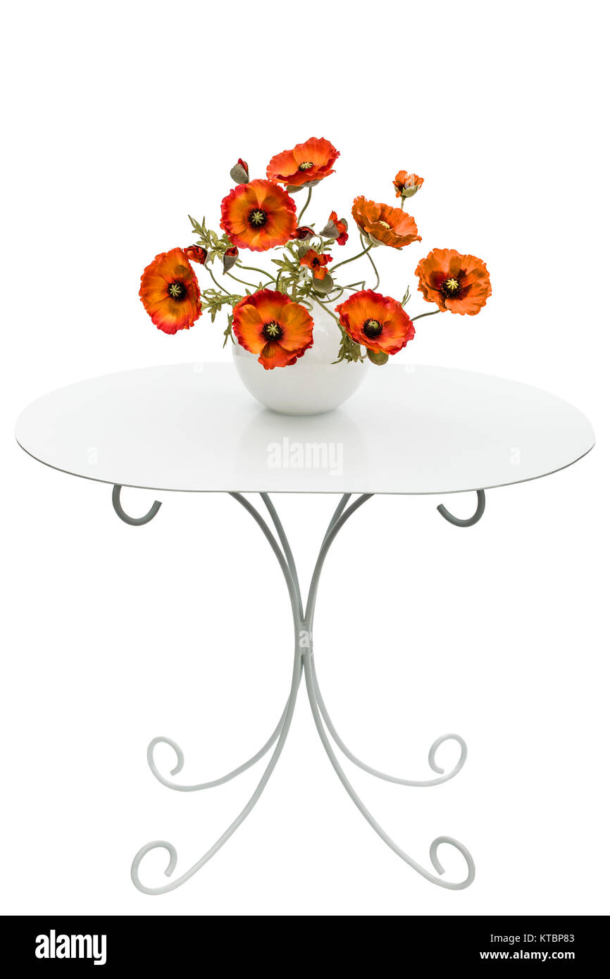 Vase with red poppies is on a coffee table, isolated on a white ...