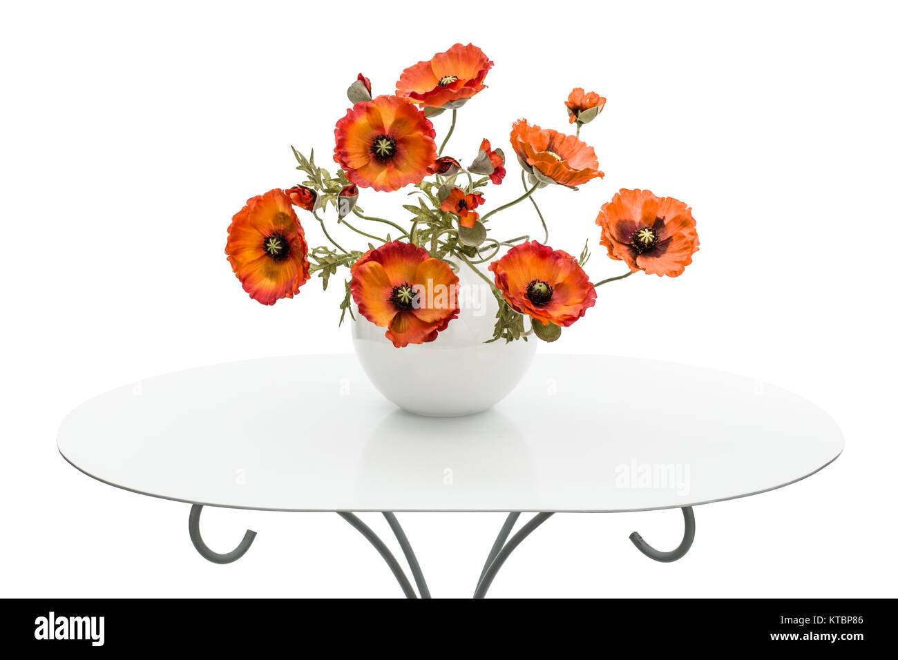 Vase with red poppies is on a coffee table, isolated on a white ...