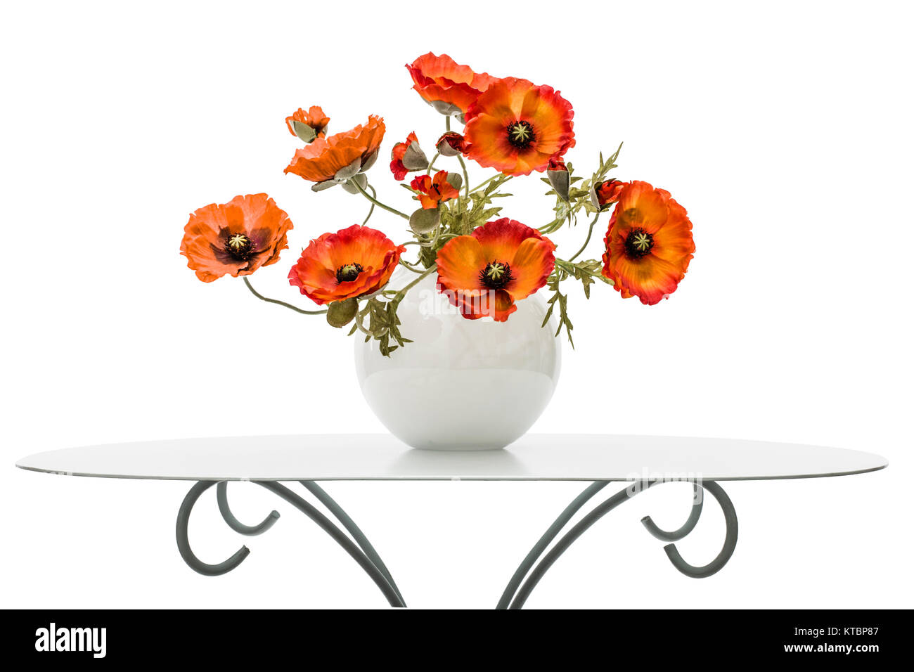 Vase with red poppies is on a coffee table, isolated on a white ...