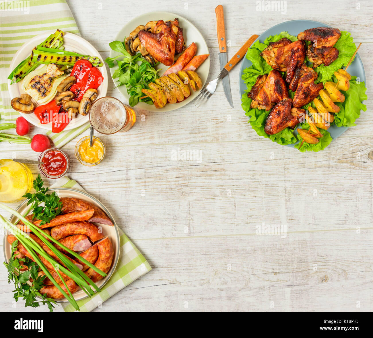 Dinner table with variety food Stock Photo - Alamy
