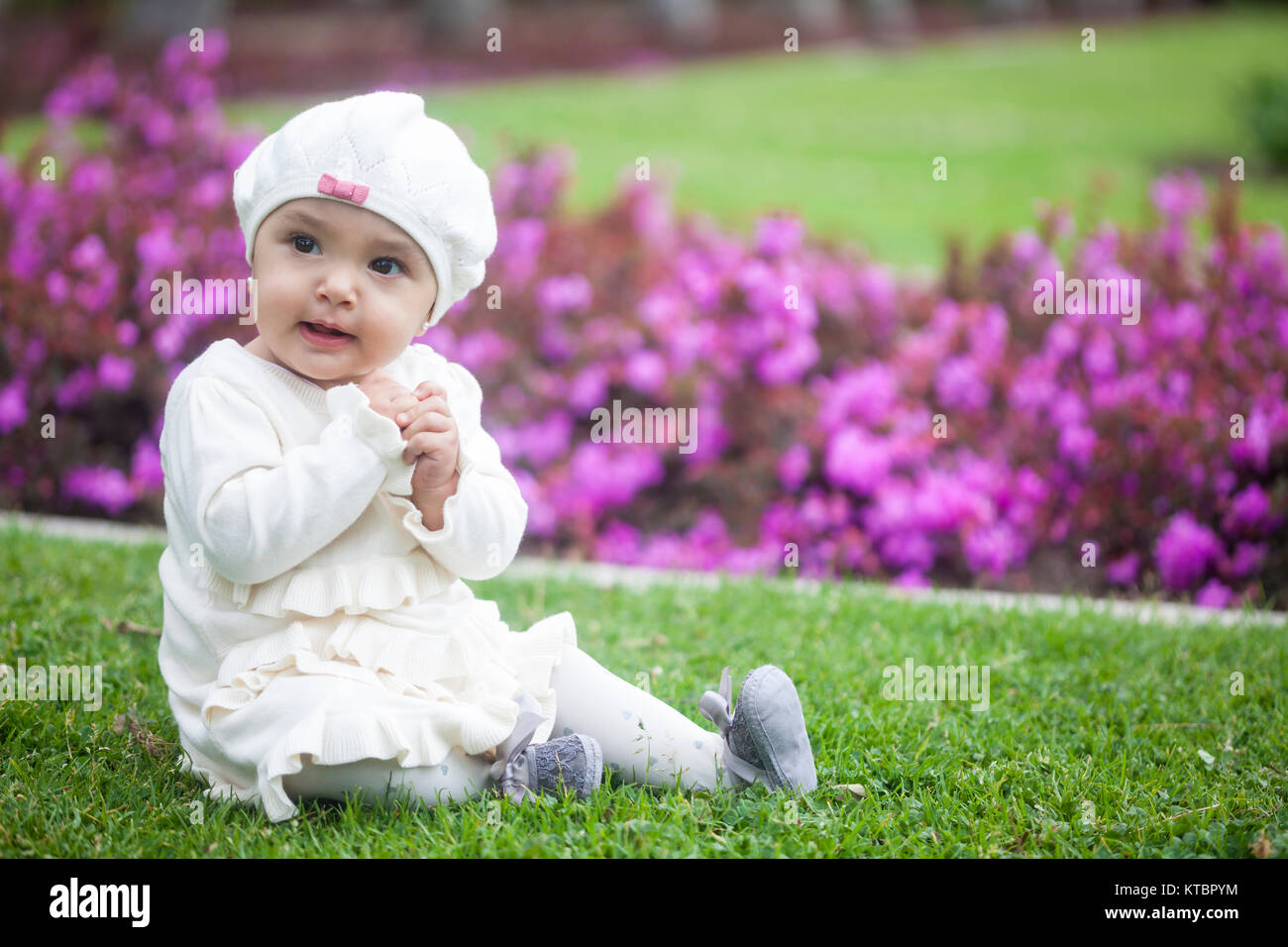 Baby girl at the garden Stock Photo - Alamy