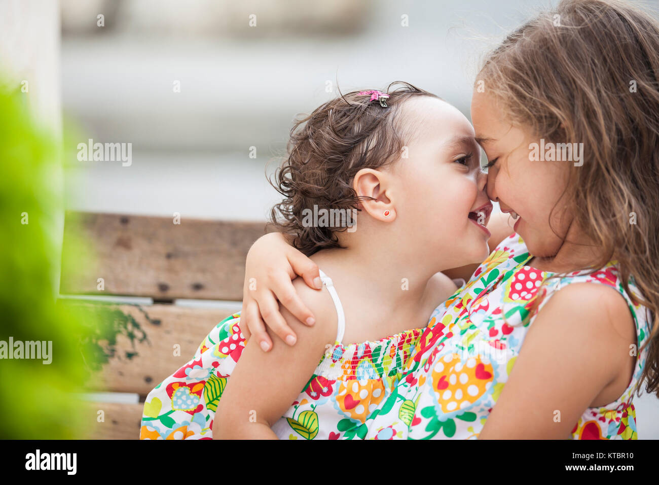 Two beautiful girls kissing smiling High Resolution Stock Photography ...
