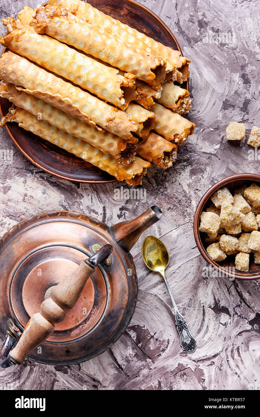 baked homemade waffle rolls with custard for tea Stock Photo - Alamy