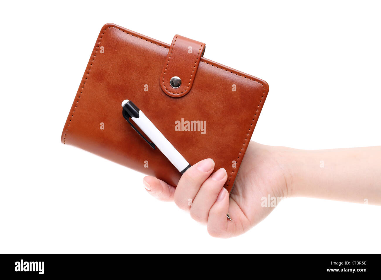Hand holding brown leather notebook isolated on white background Stock ...