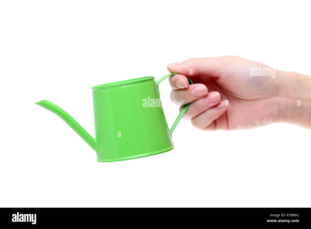 Hand holding watering can isolated on white background Stock Photo - Alamy