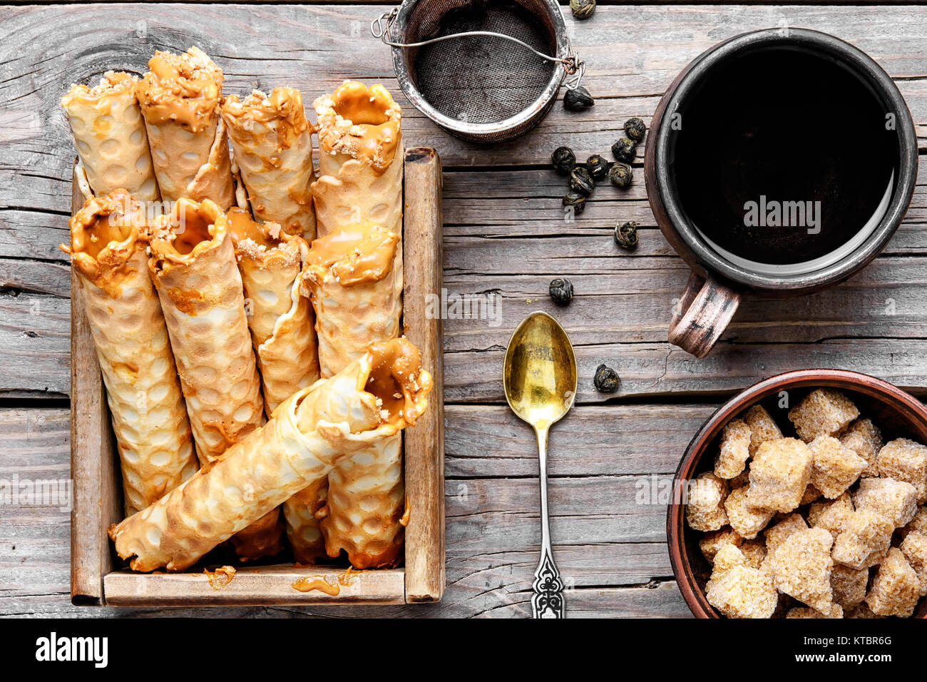 baked homemade waffle rolls with custard for tea Stock Photo - Alamy