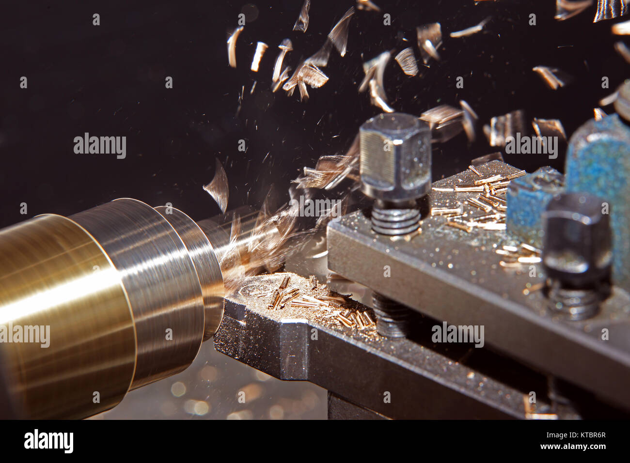 metal working on lathe grinder machine with flying shavings Stock Photo ...